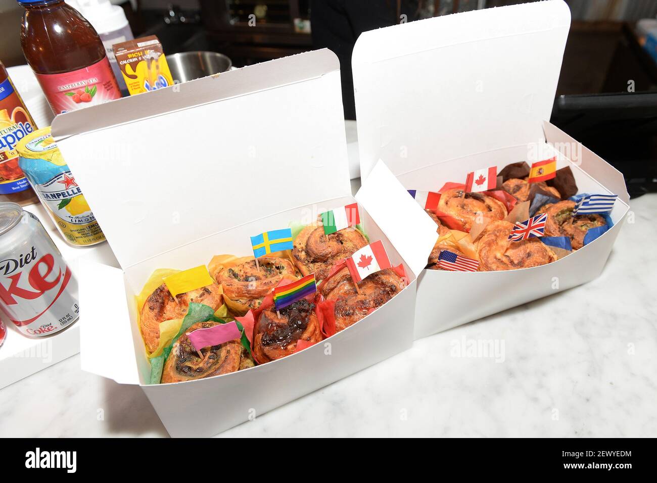 Two boxes of Bruffins, hybrid Brioche-Muffin Pastry, adorned with flags ...