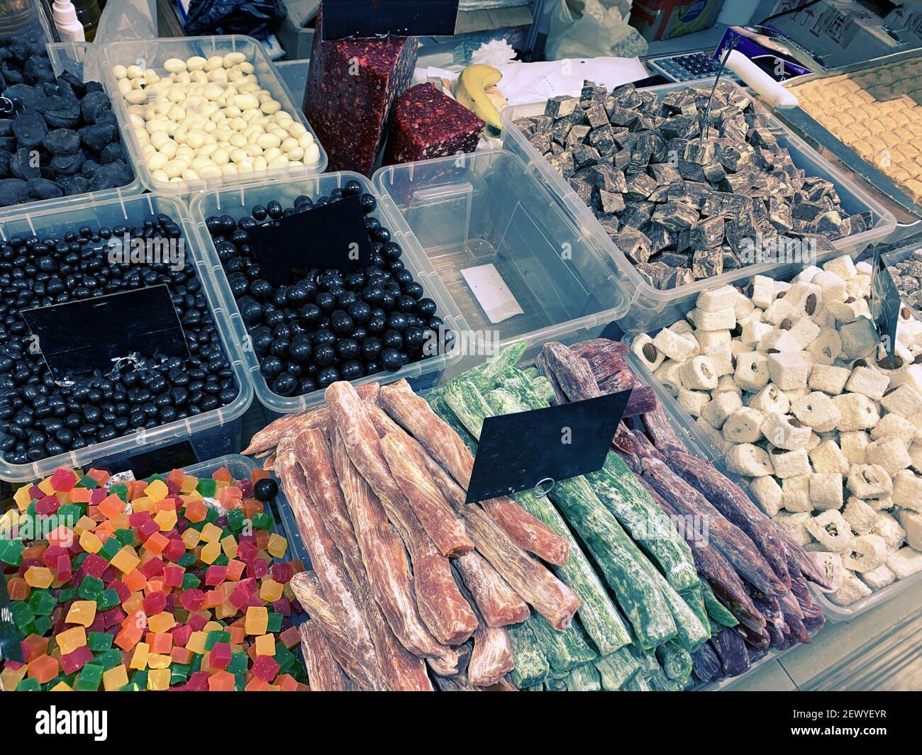 Different sweets on a showcase of a store Stock Photo - Alamy