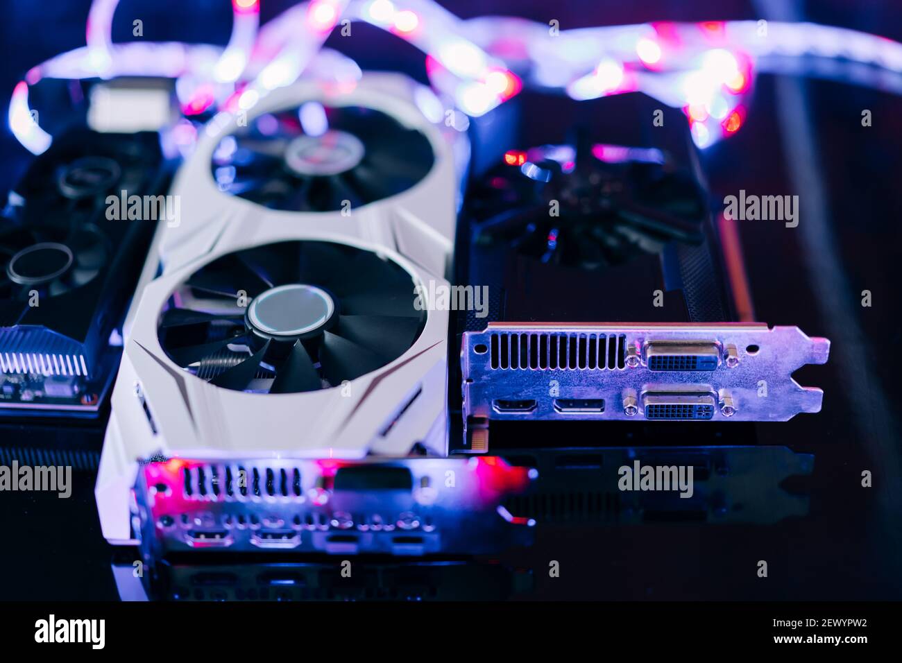 Graphics cards of different sizes and configurations on black table ...