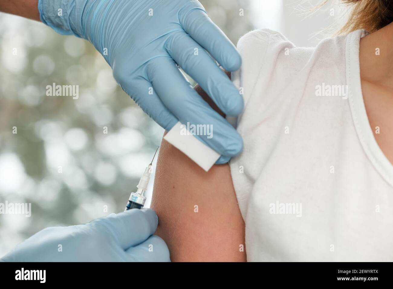 Doctor hands making vaccination in the shoulder of patient Stock Photo ...