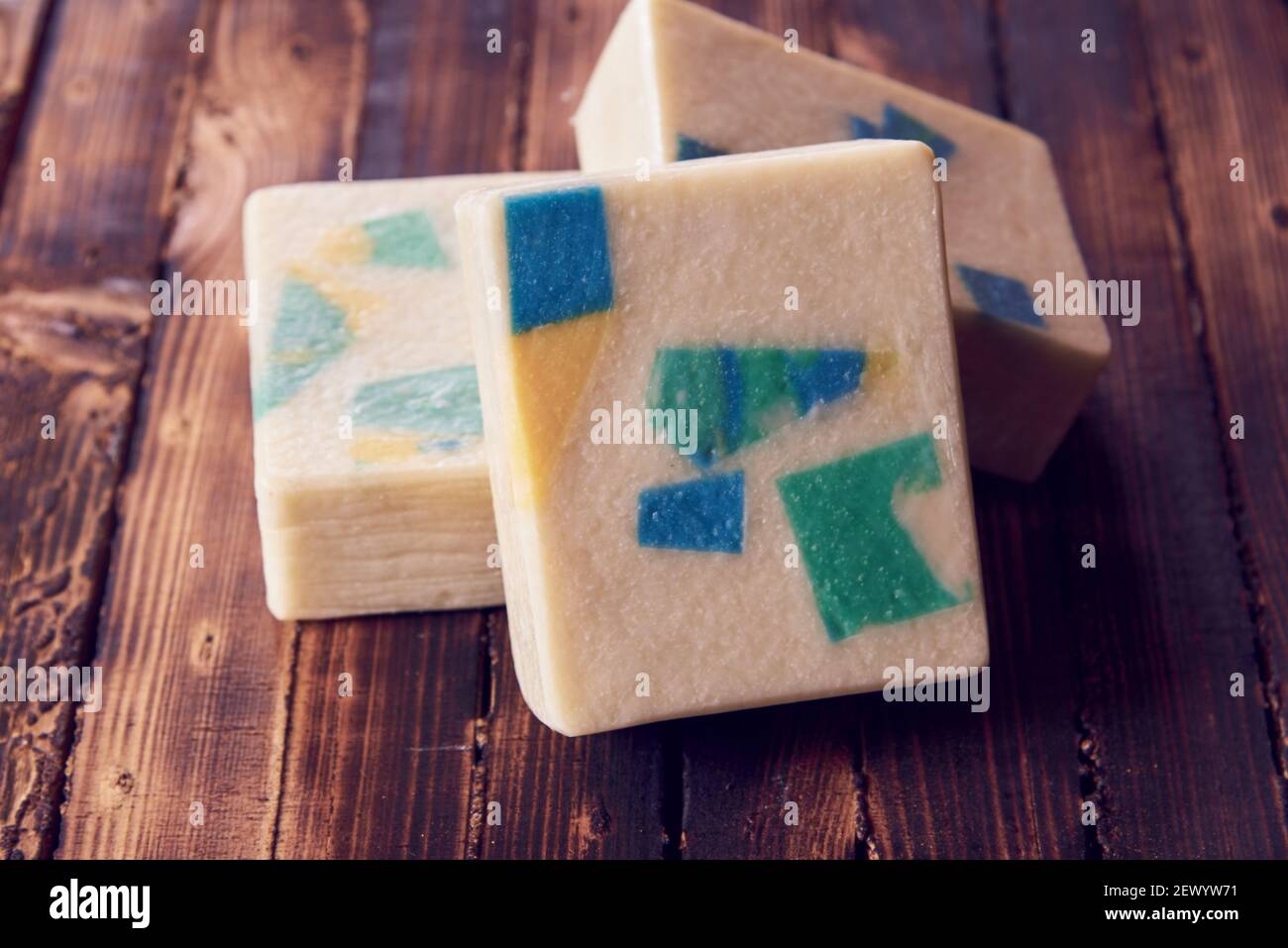 A fragrant organic handmade soap with a geometric pattern on a brown ...