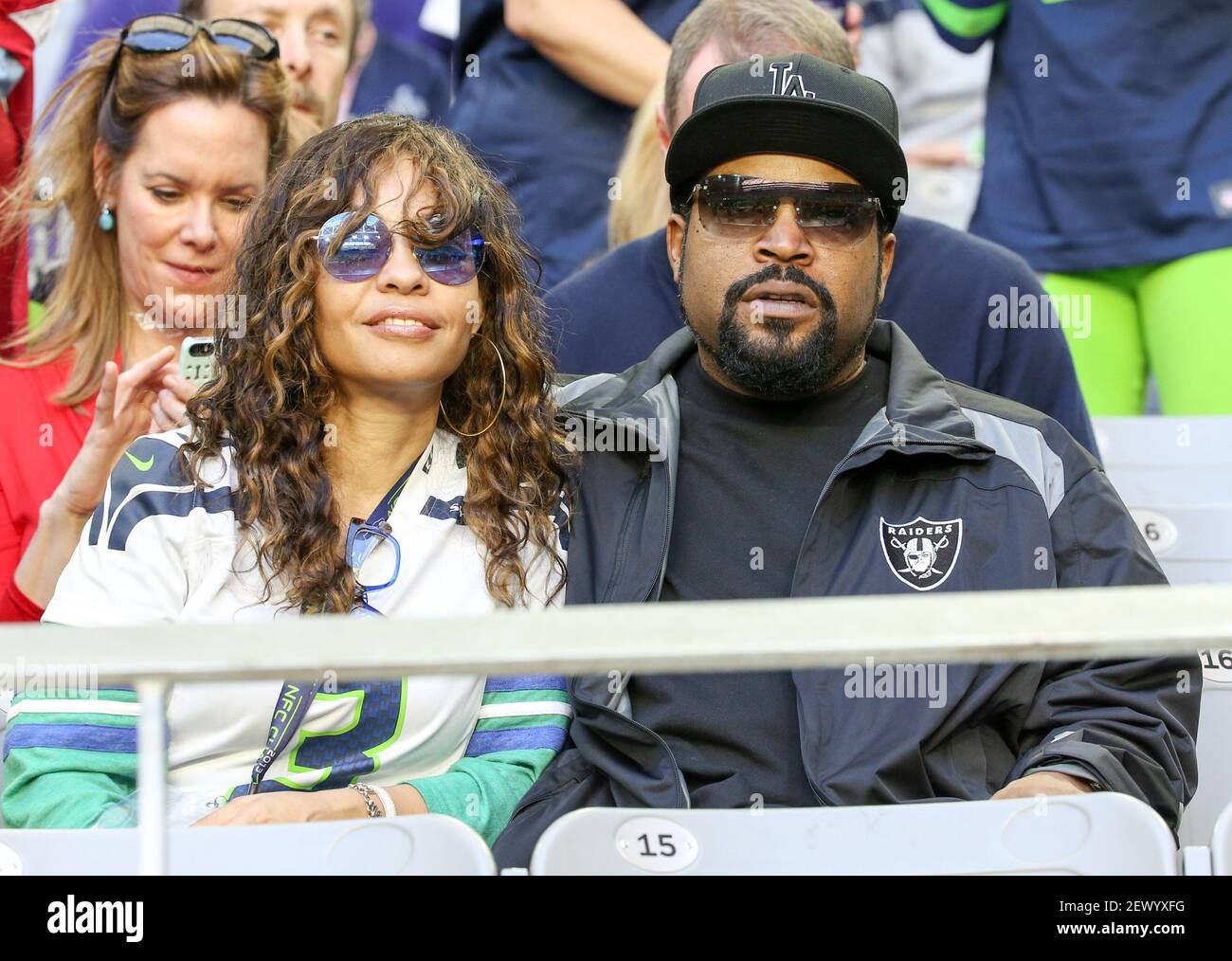 Rapper Ice Cube (R ) and his wife attend Super Bowl XLIV held at The ...