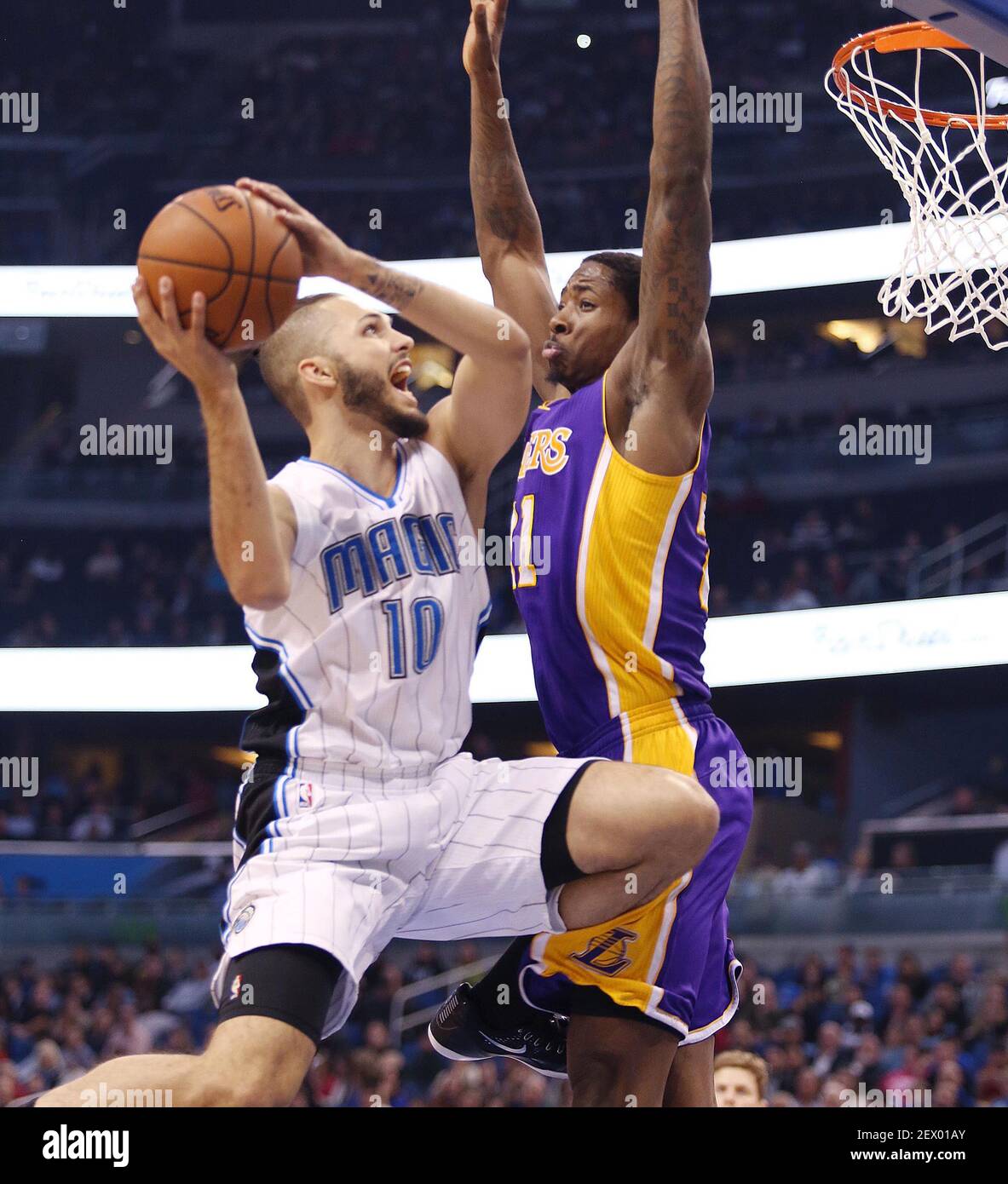 The Los Angeles Lakers' Ed Davis (21) stops the Orlando Magic's Evan ...