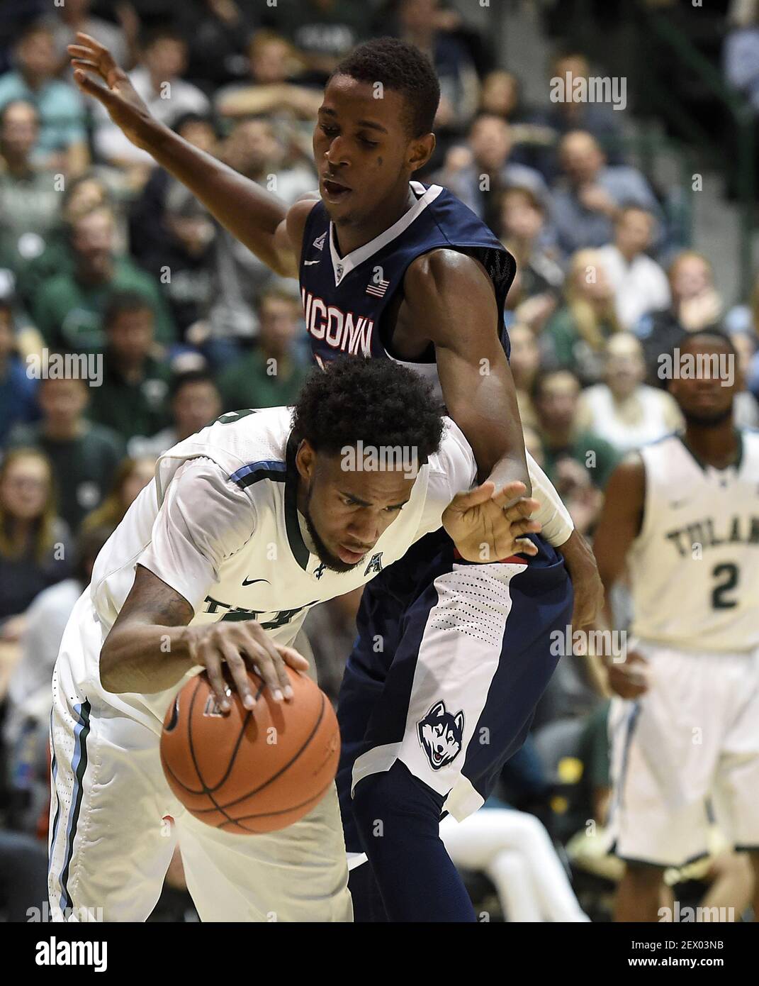 Tulane's Jay Hook, left, drives against Connecticut's Phillip Nolan ...