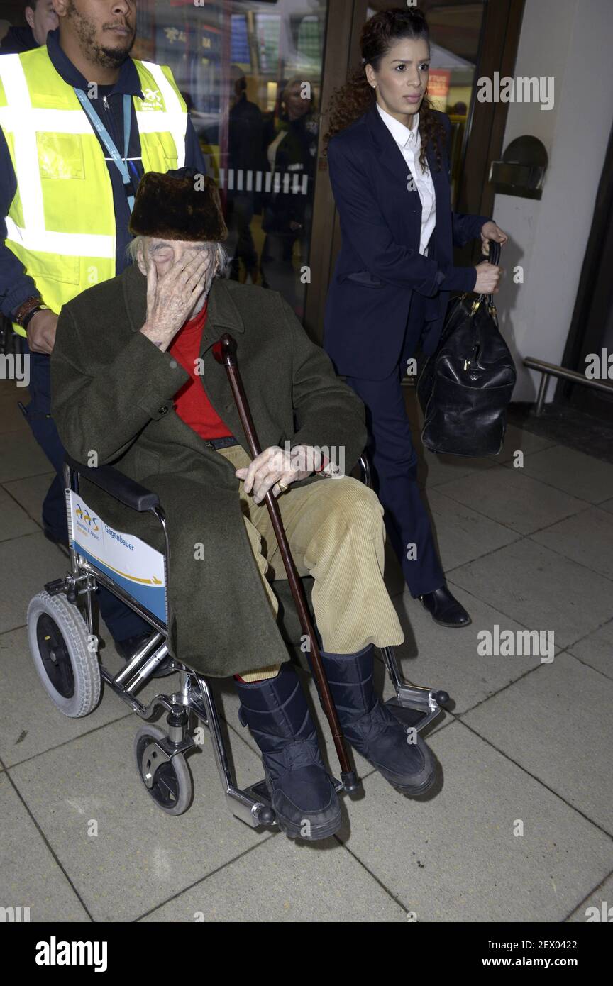 Christopher Lee and his wife Birgit Kroencke arrive at the airport in ...