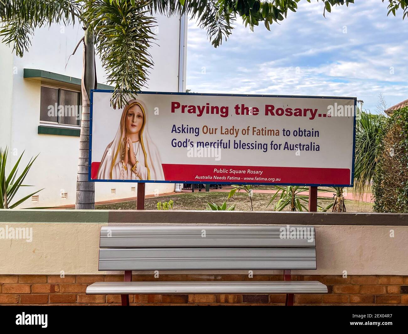 Sign “Praying the Rosary…” of Our Lady of Fatima near the Sacred Heart ...