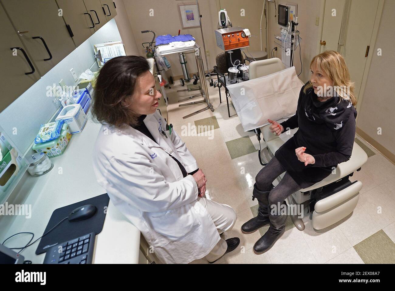 Laura Alba, left, a hepatologist and transplant specialist, speaks with ...