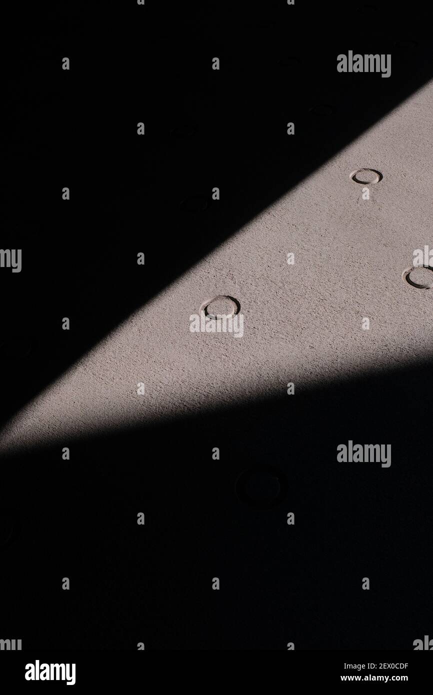A closeup of a triangle shadow on the concrete ground Stock Photo - Alamy