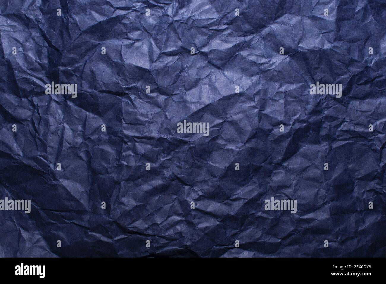 A background or wallpaper with crumpled blue paper textures Stock Photo ...