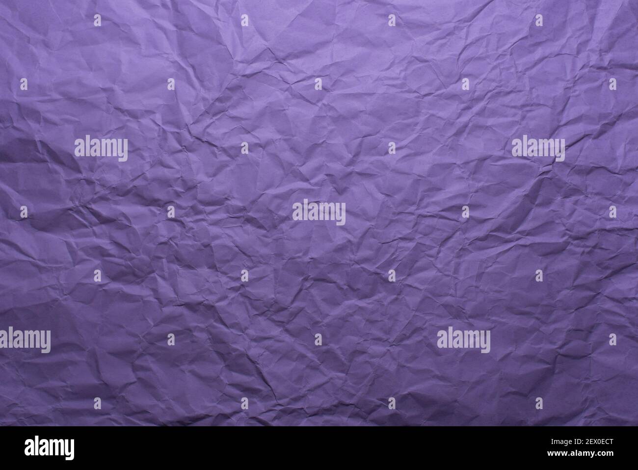 A background or wallpaper with crumpled purple paper textures Stock ...