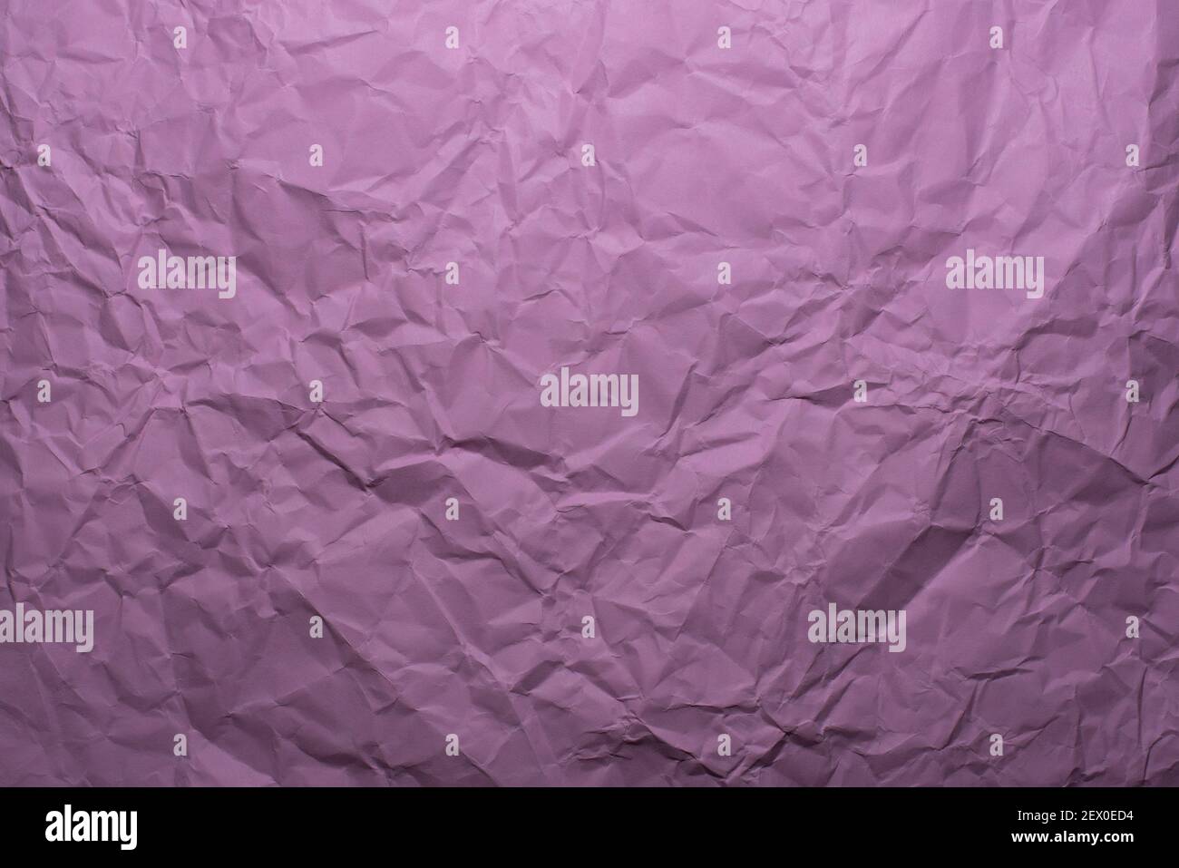 A background or wallpaper with crumpled purple paper textures Stock ...