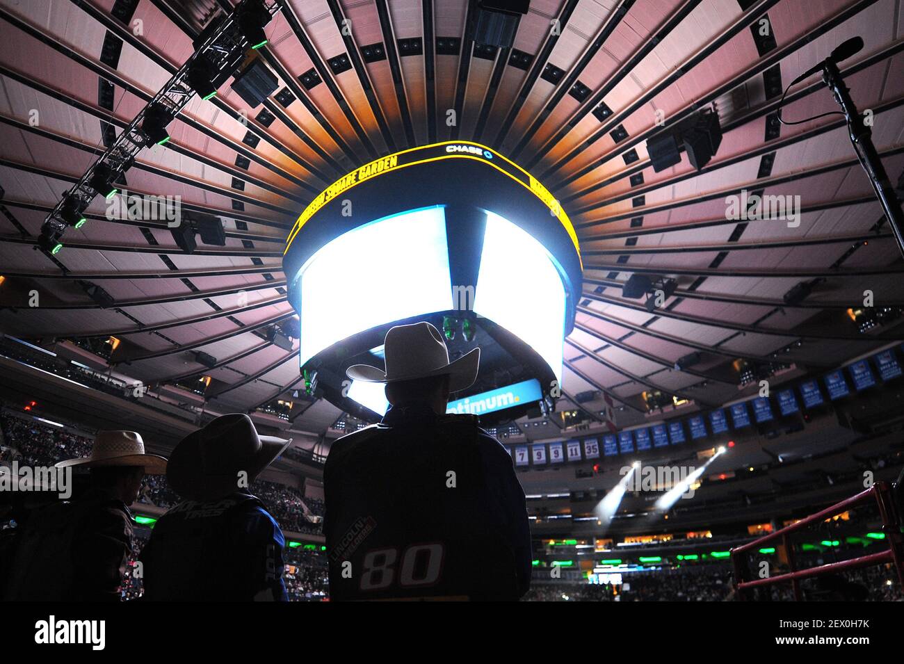 A Professional Bull riders stands in the arena at the beginning of the ...