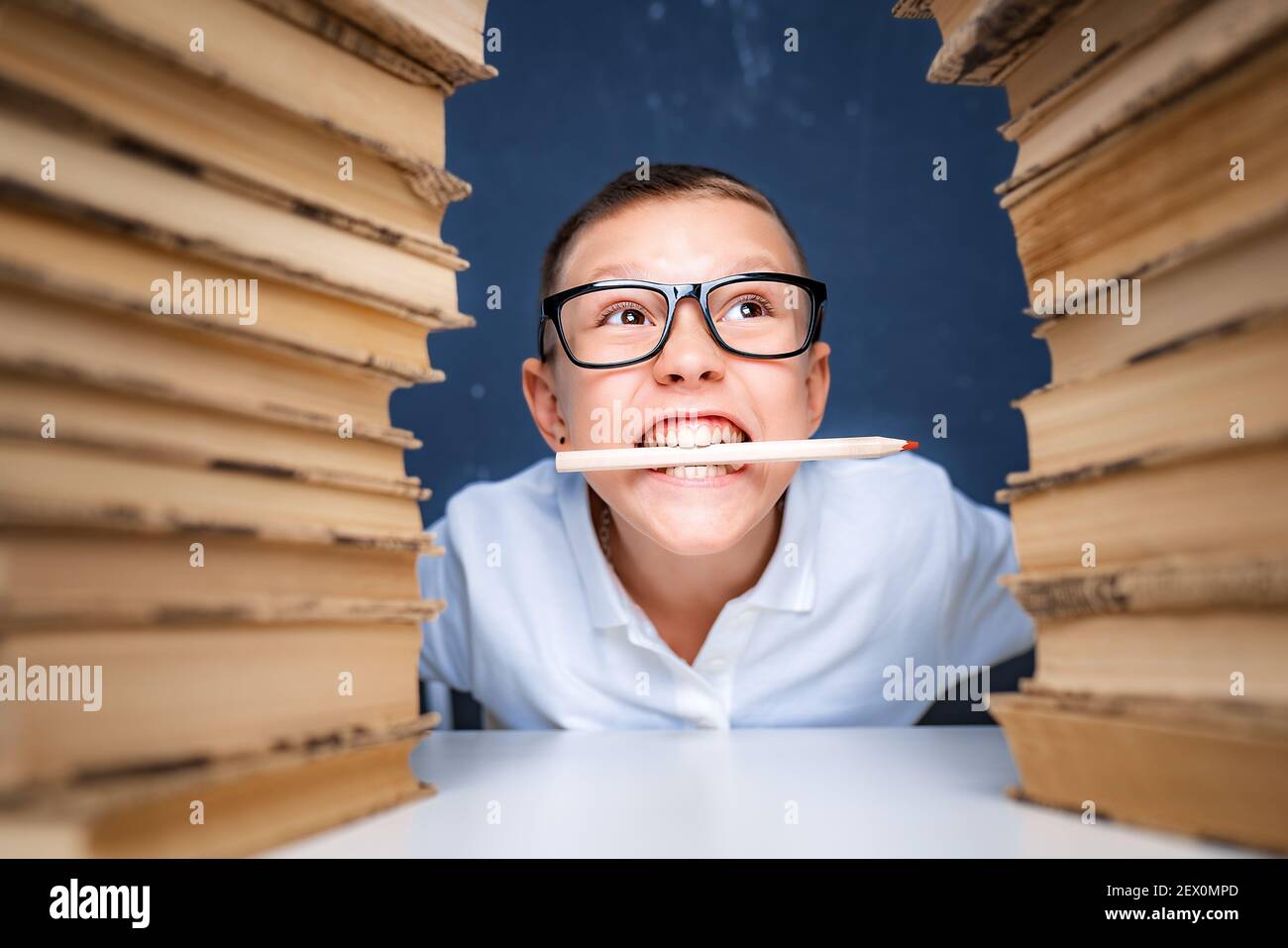 Child pencil in mouth hi-res stock photography and images - Alamy