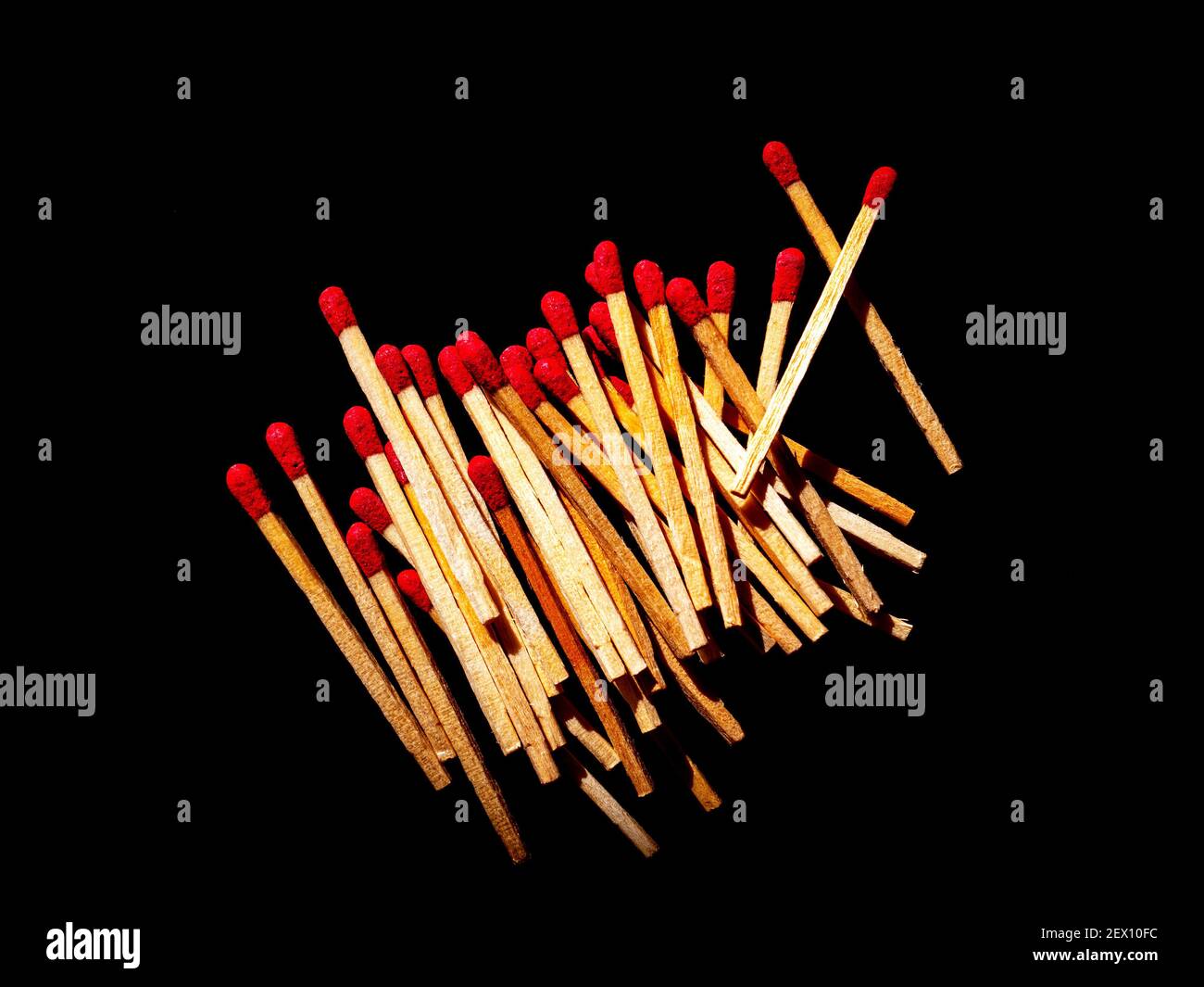 Wooden matches with red sulfur heads on a black background. Fire ...