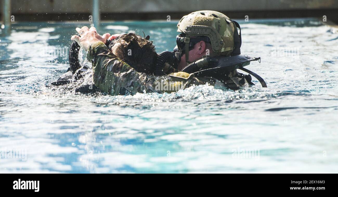 Special Forces Underwater Operations instructors demonstrate buddy ...