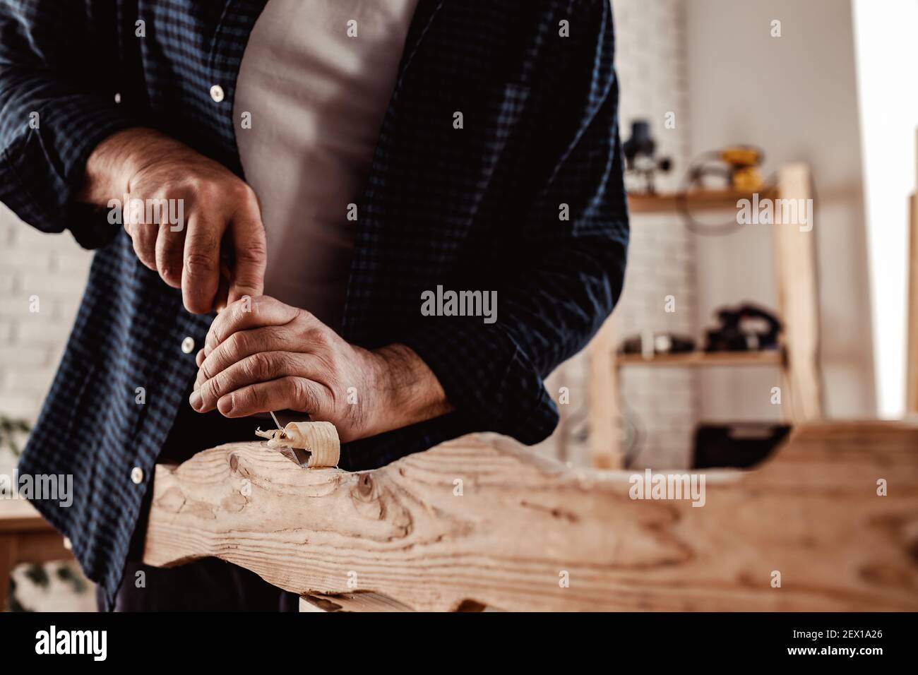 Hands of a carpenter working with chisel and hammer Stock Photo - Alamy