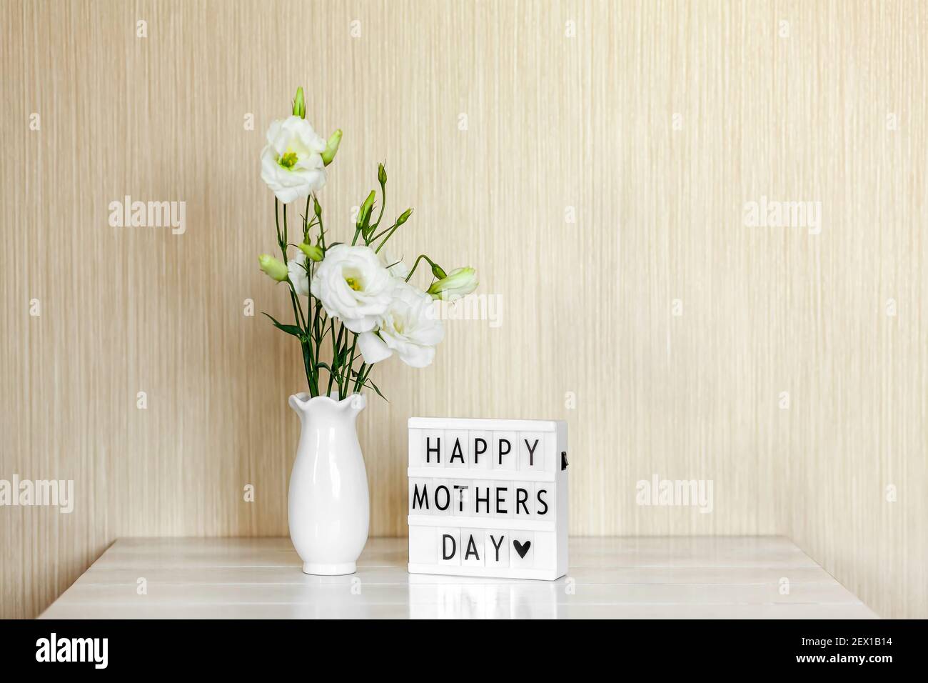 Light box with lettering Happy Mother's Day, white flowers Eustoma or ...