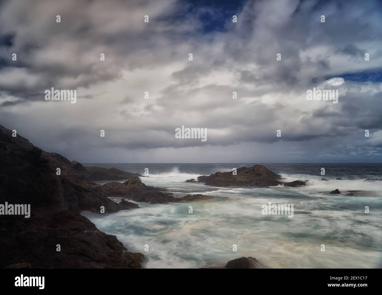 A beautiful seascape under a scenic and cloudy sky in Gran Canaria ...