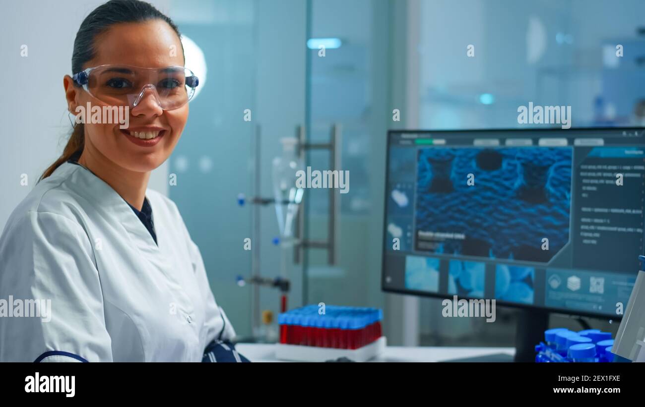 Smiling chemist wearing safety glasses hi-res stock photography and ...