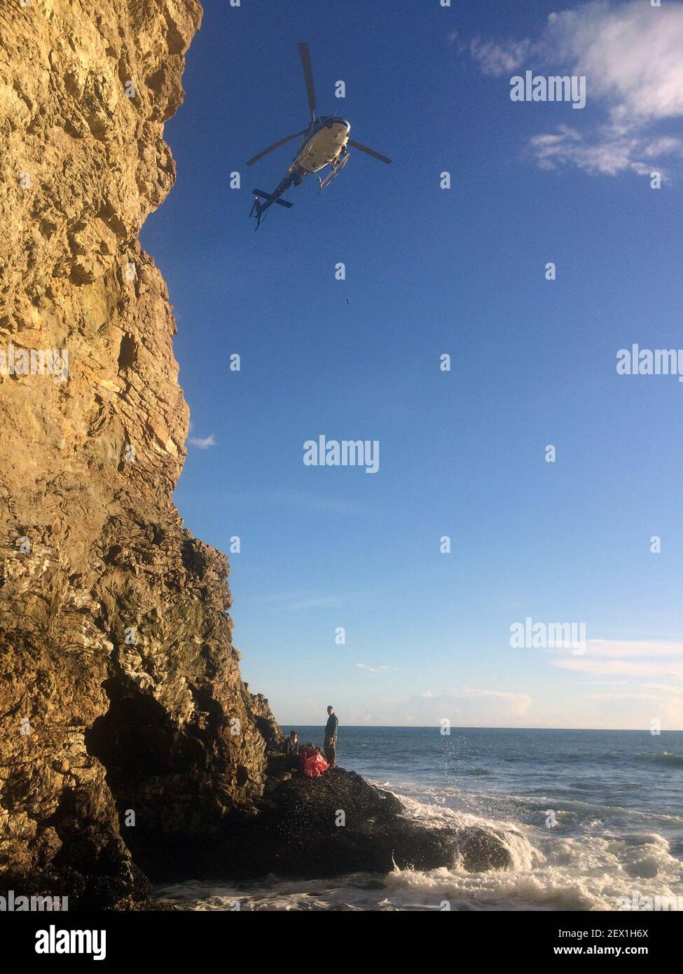 A helicopter arrives to airlift a man at Point Reyes, Calif., after he ...