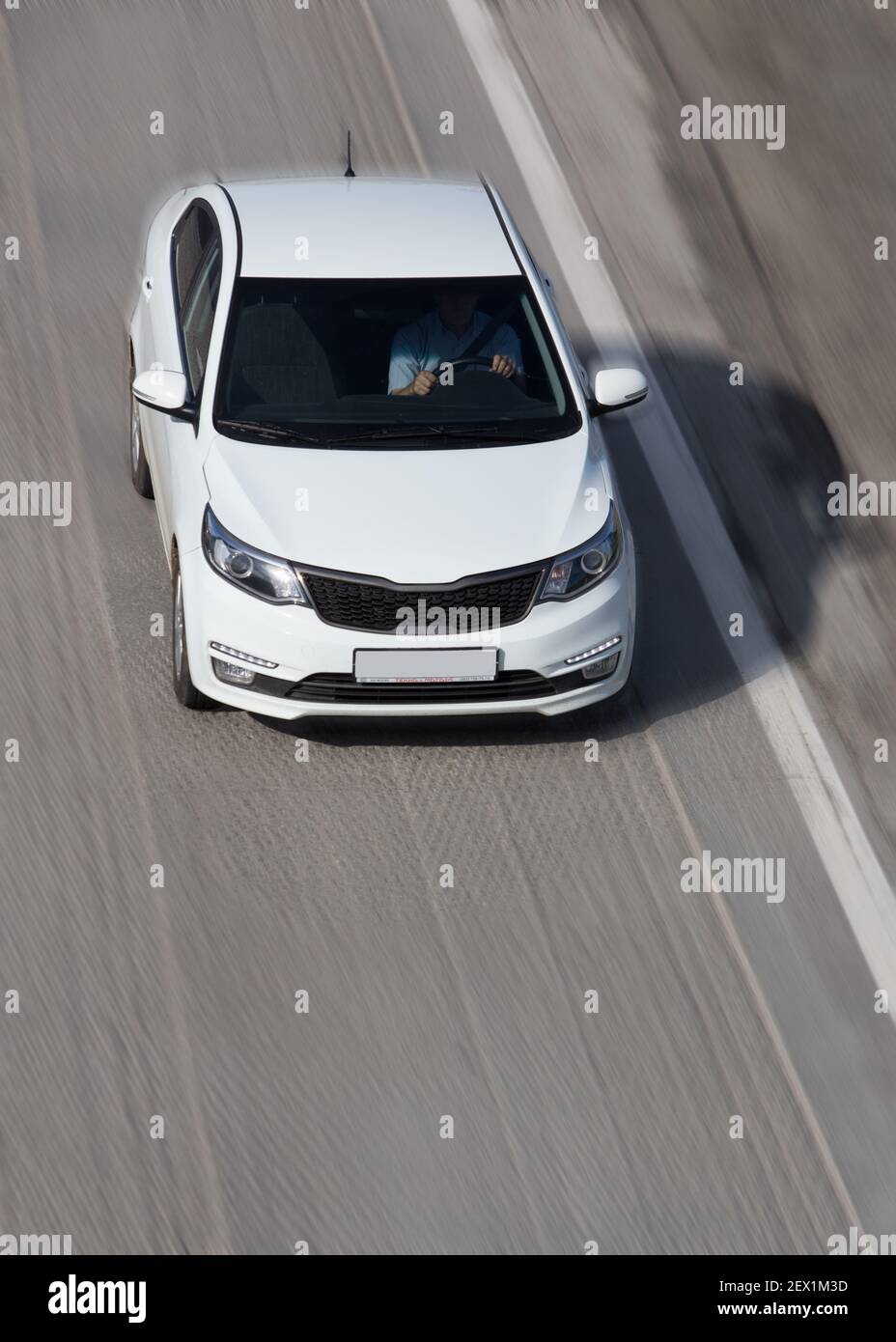 modern white car driving on street Stock Photo - Alamy