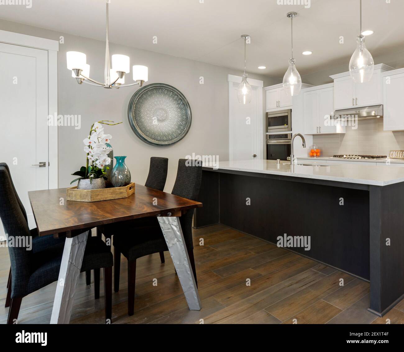 Modern residential dining room and kitchen interior Stock Photo - Alamy