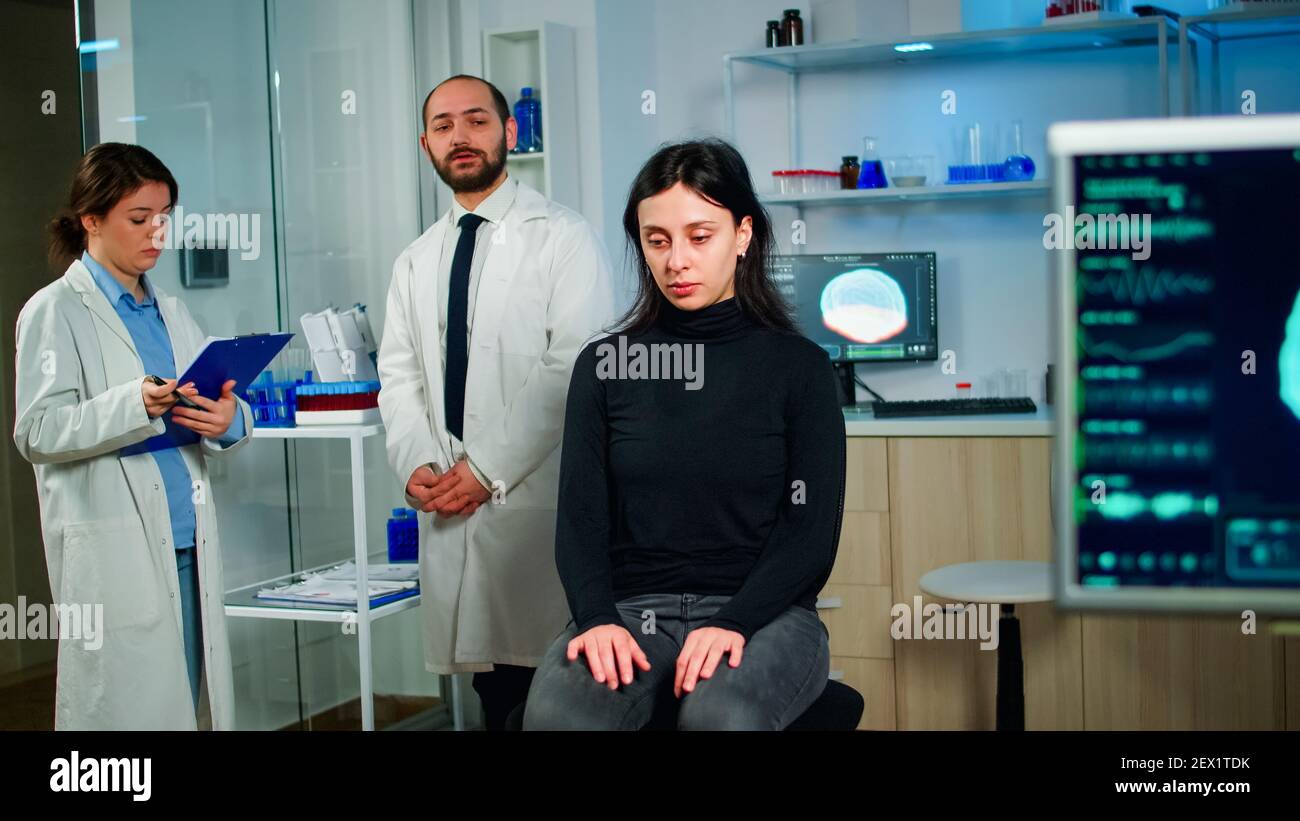 Team of scientists specializing in neurological medicine discussing ...