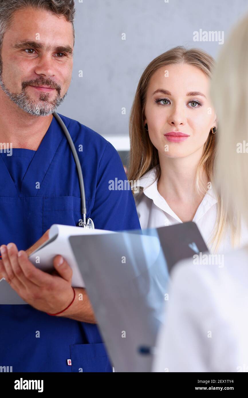 Smiling handsome doctor communicate with patient Stock Photo - Alamy