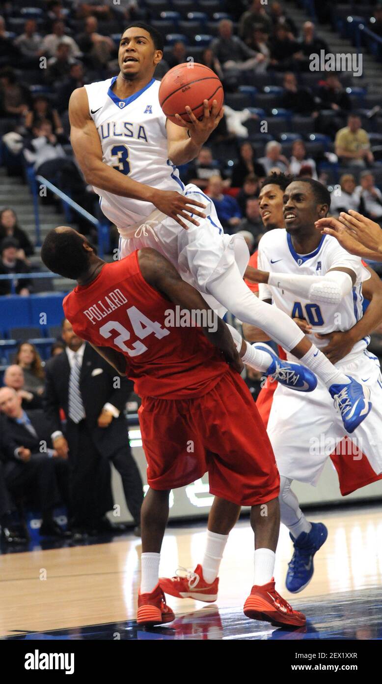 Tulsa's Shaquille Harrison (3) drives to the basket over Houston's ...