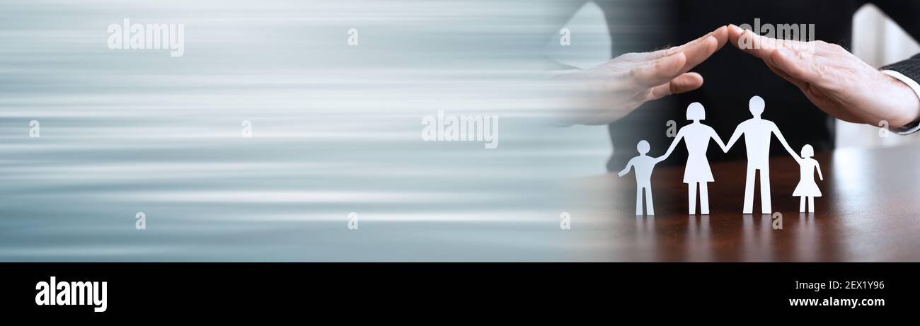 Insurer protecting a family, concept of insured family; panoramic ...