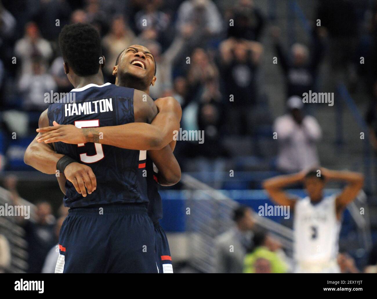 Connecticut's Rodney Purvis hugs teammate Daniel Hamilton (5) near the ...