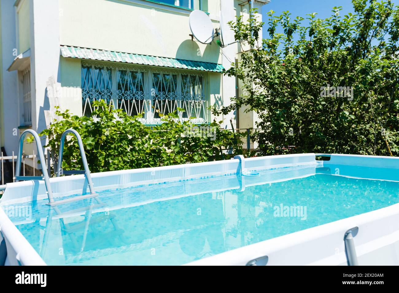 Private swimming pool at summertime Stock Photo - Alamy