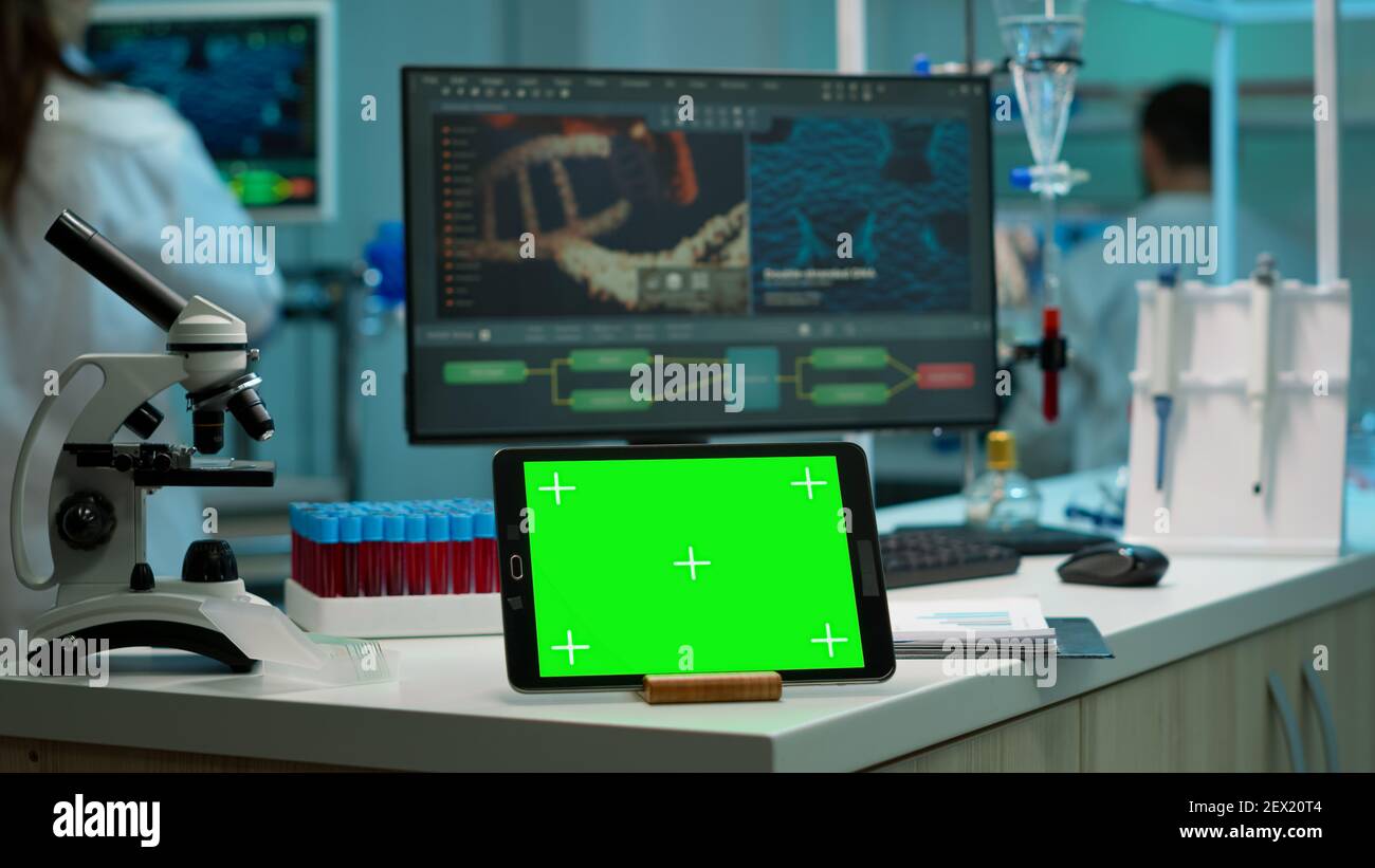 Display tablet with green screen, mock up on template placed on desk in ...