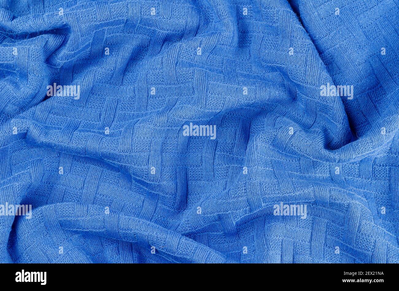 Crumpled blue fabric background. Crumpled sweater. Casual wear ...