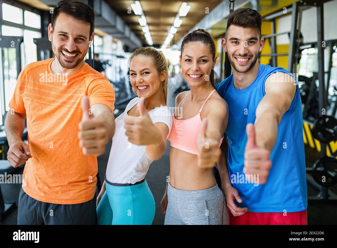 Group of fit young people exercising at the gym Stock Photo - Alamy