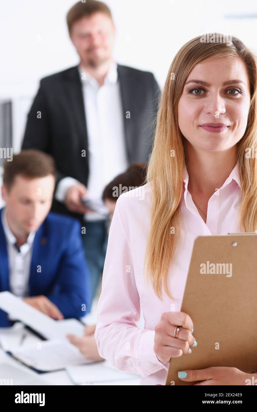 Beautiful smiling cheerful girl at workplace look in camera Stock Photo ...