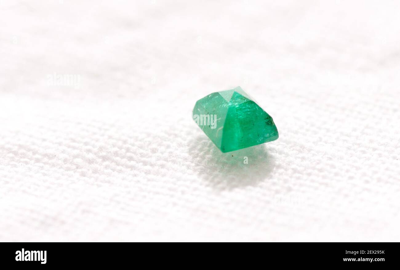 vibrant green beryl jewel cut crystal on a white background Stock Photo ...