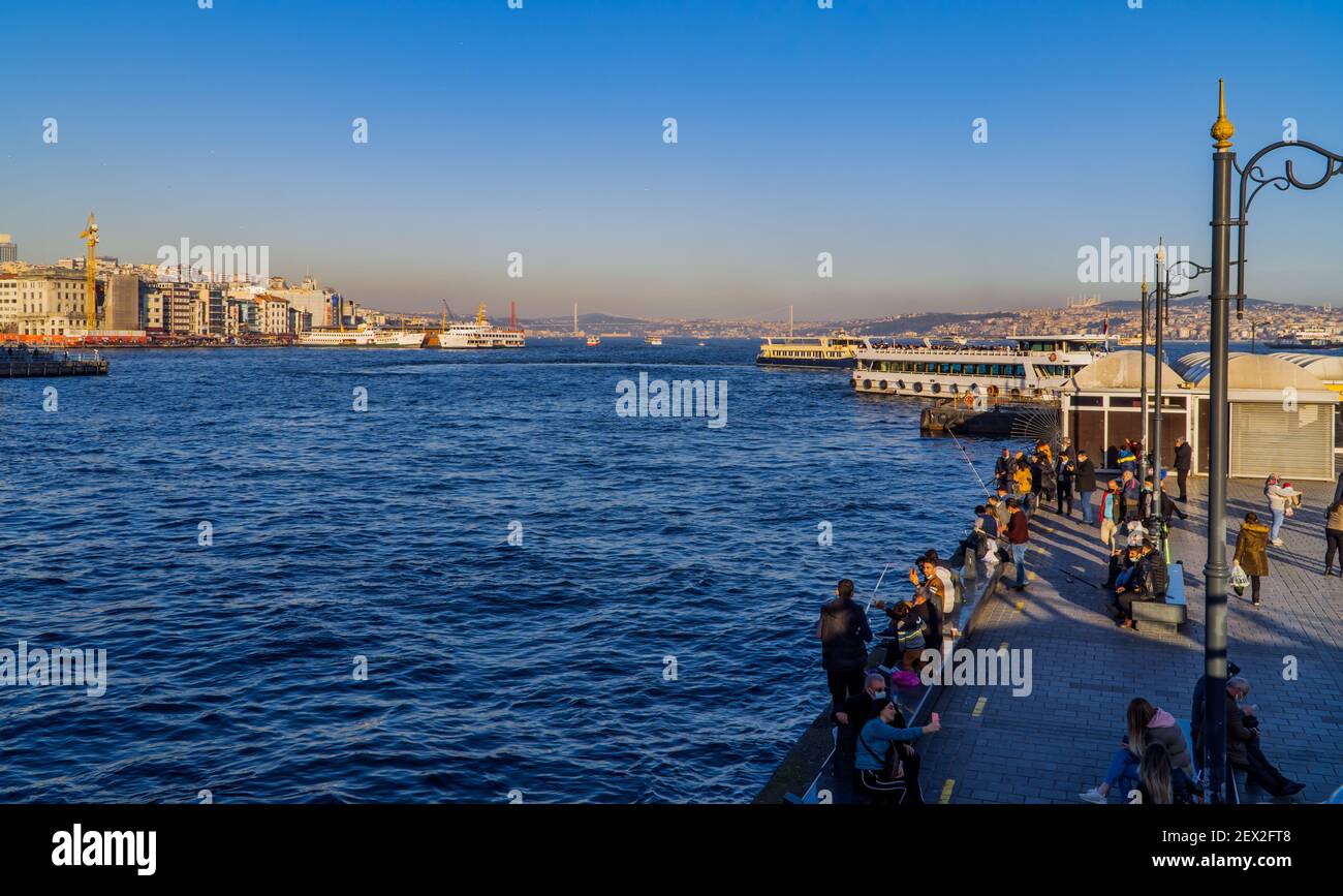 Istanbul, Turkey - February 1, 2021 - boats and people on the Bosphorus ...