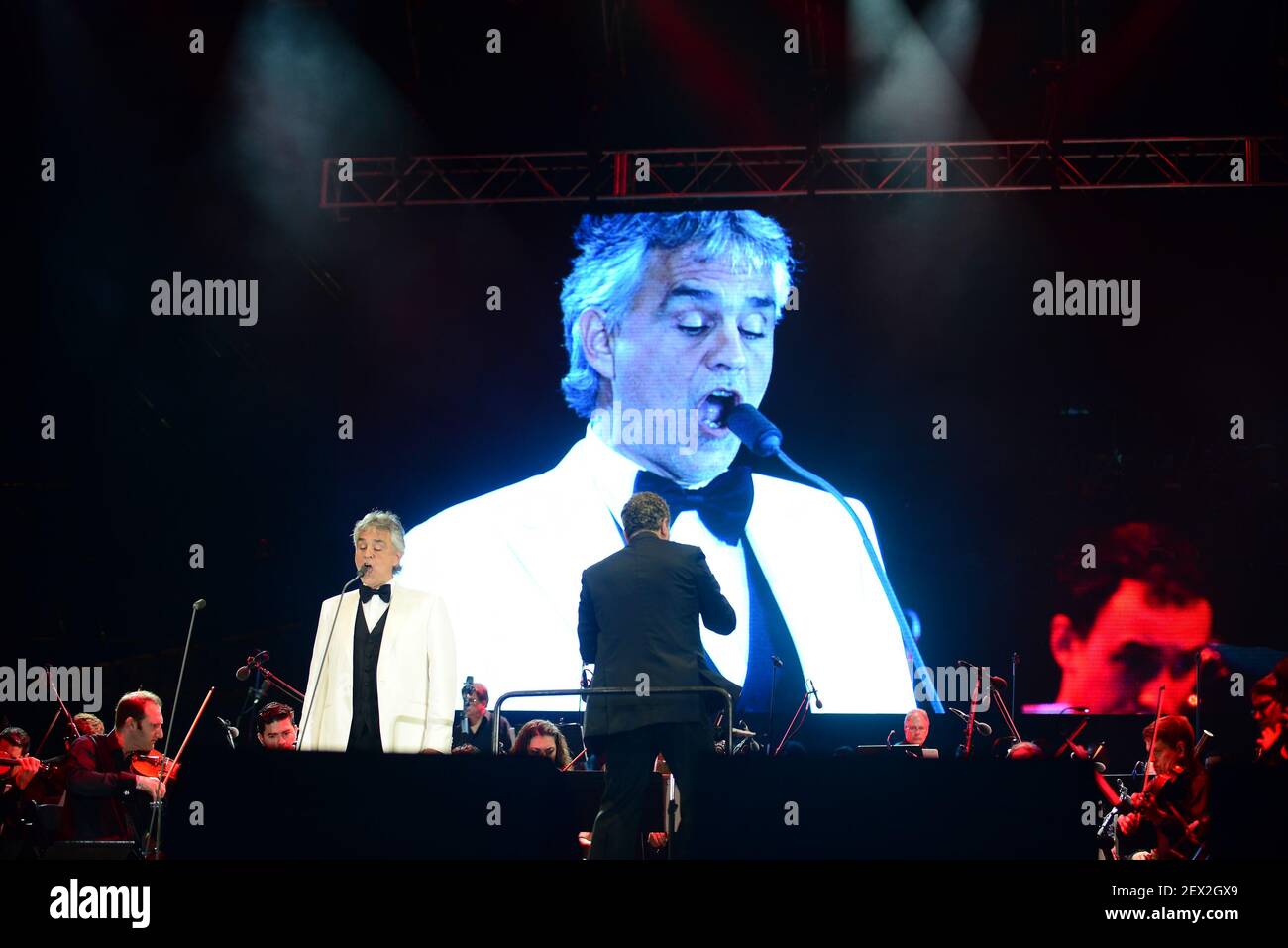 Andrea Bocelli and Conductor Eugene Kohn performs onstage during the ...