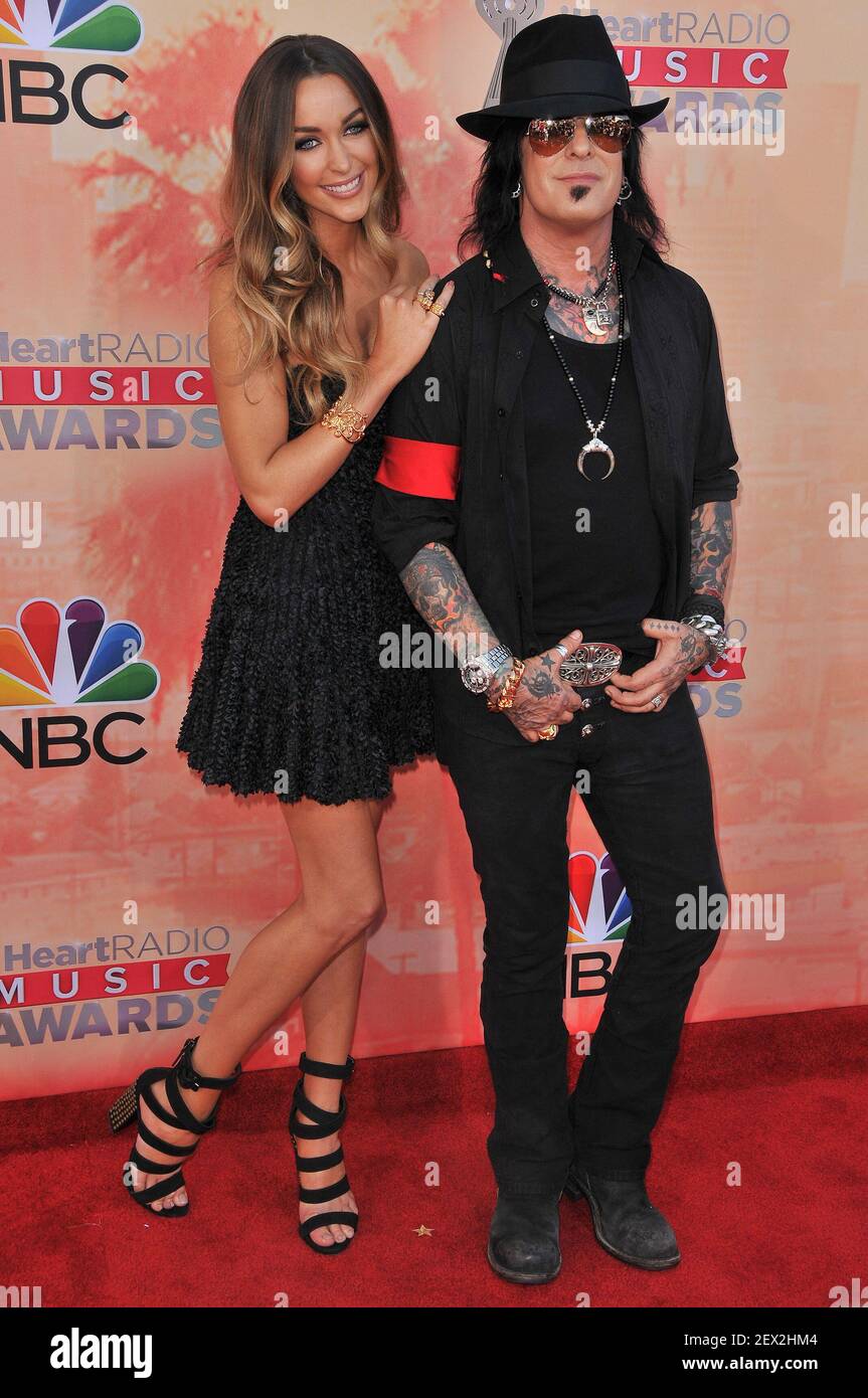 (L-R) Courtney Bingham and Nikki Sixx arrives at the 2015 iHeartRadio ...