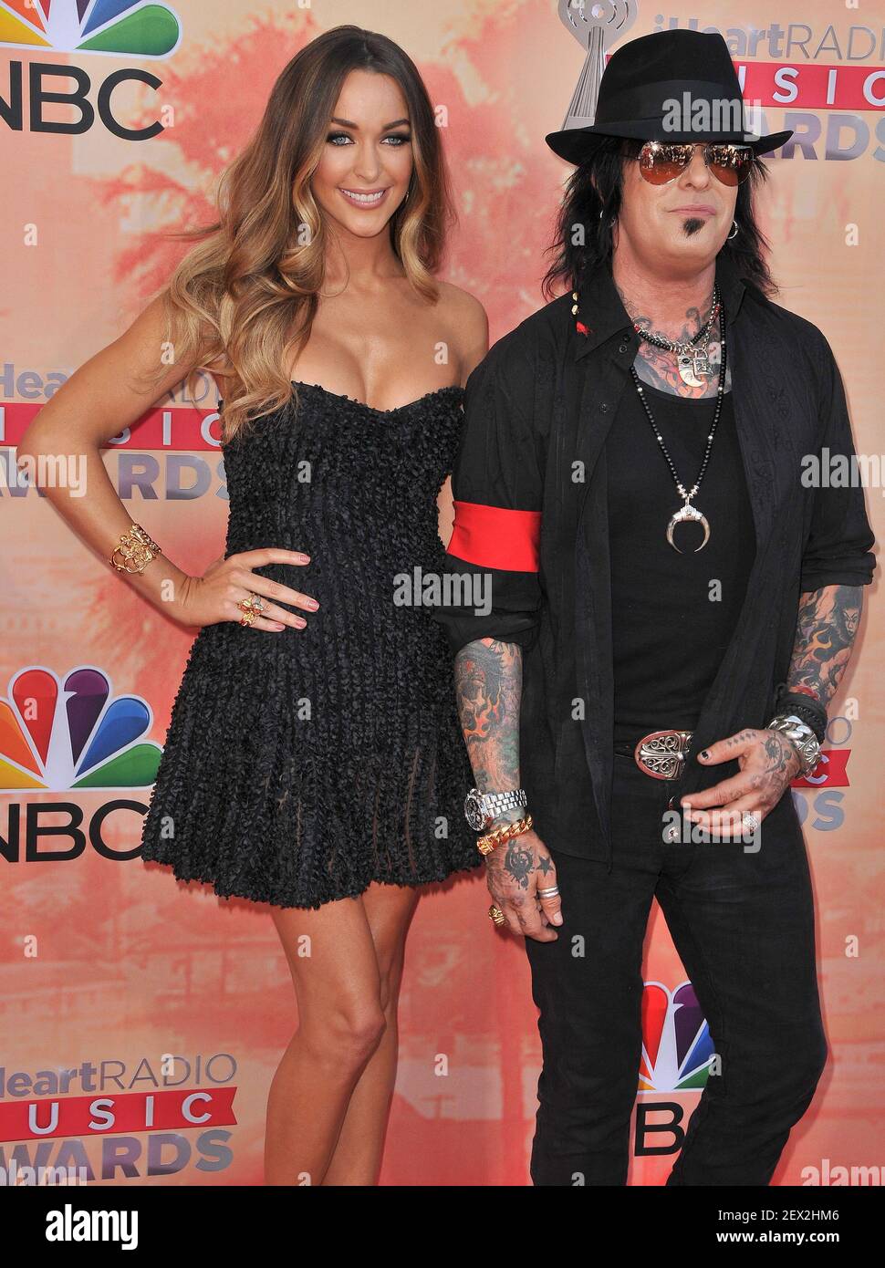 (L-R) Courtney Bingham and Nikki Sixx arrives at the 2015 iHeartRadio ...