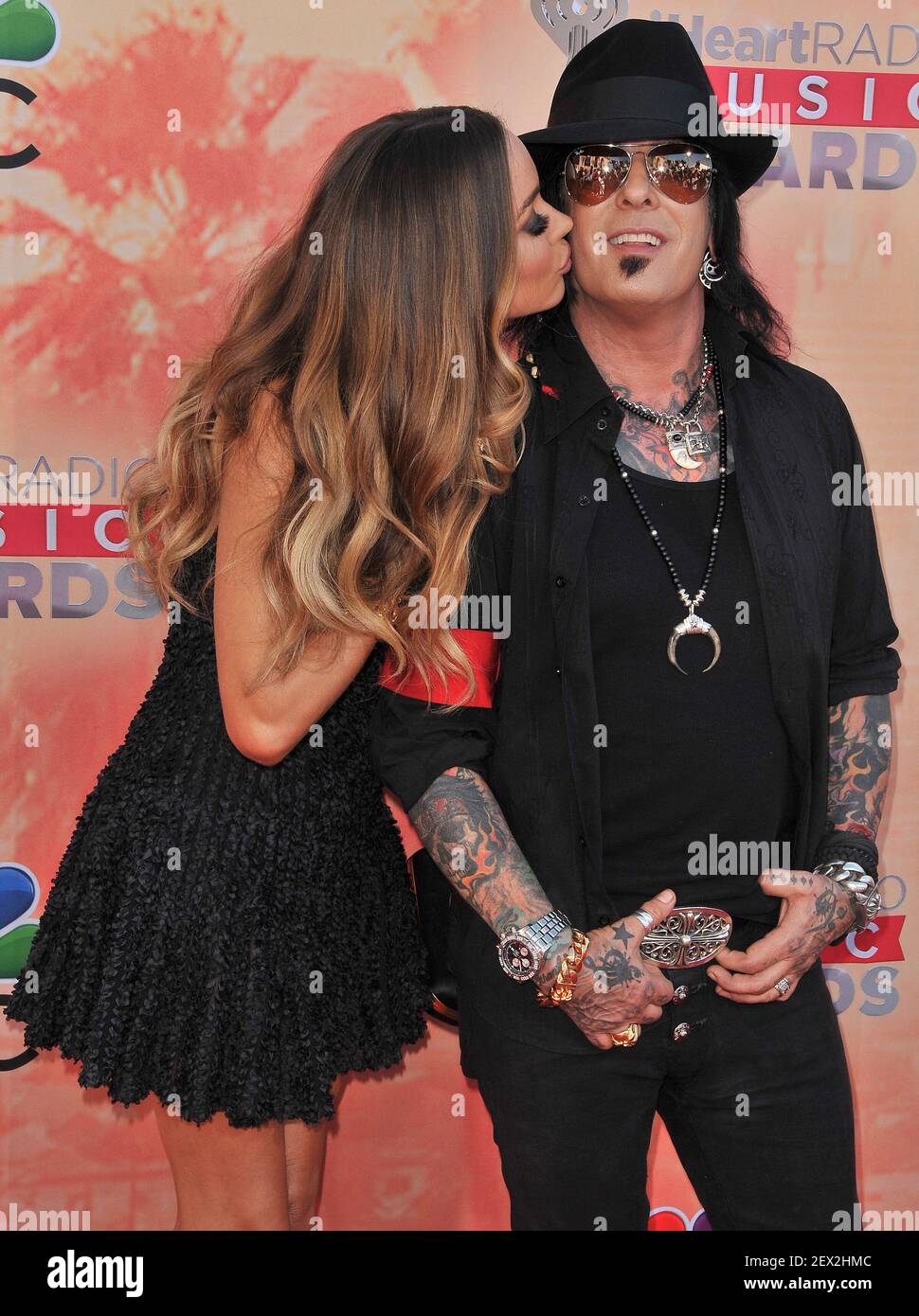 (L-R) Courtney Bingham and Nikki Sixx arrives at the 2015 iHeartRadio ...