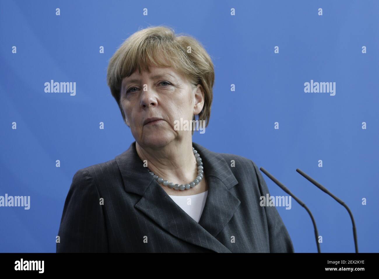 President of Kyrgyzstan, and the German Chancellor Angela Merkel give a ...