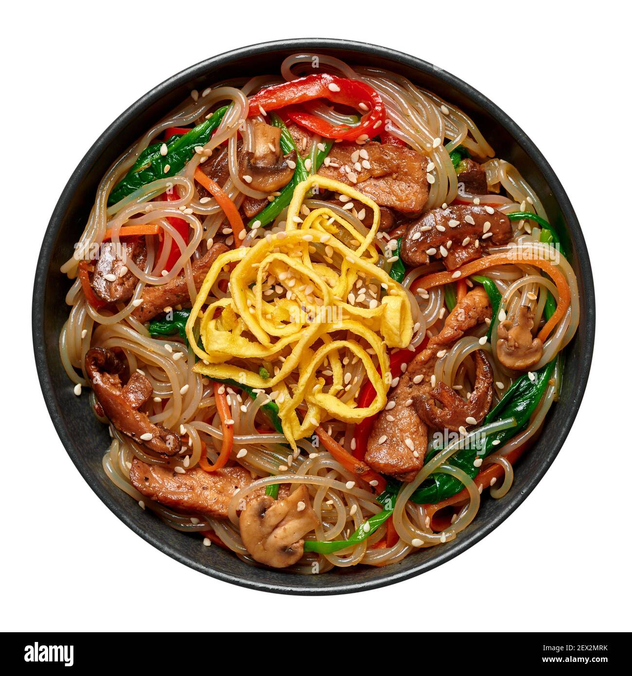 Japchae in black bowl isolated on white. Korean cuisine glass chapchae ...