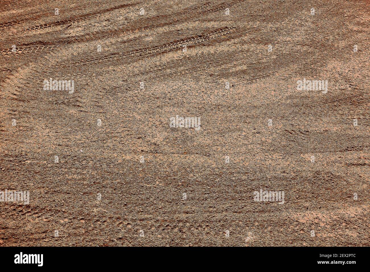 Dirt on construction site with equipment tracks, flat ground brown and ...