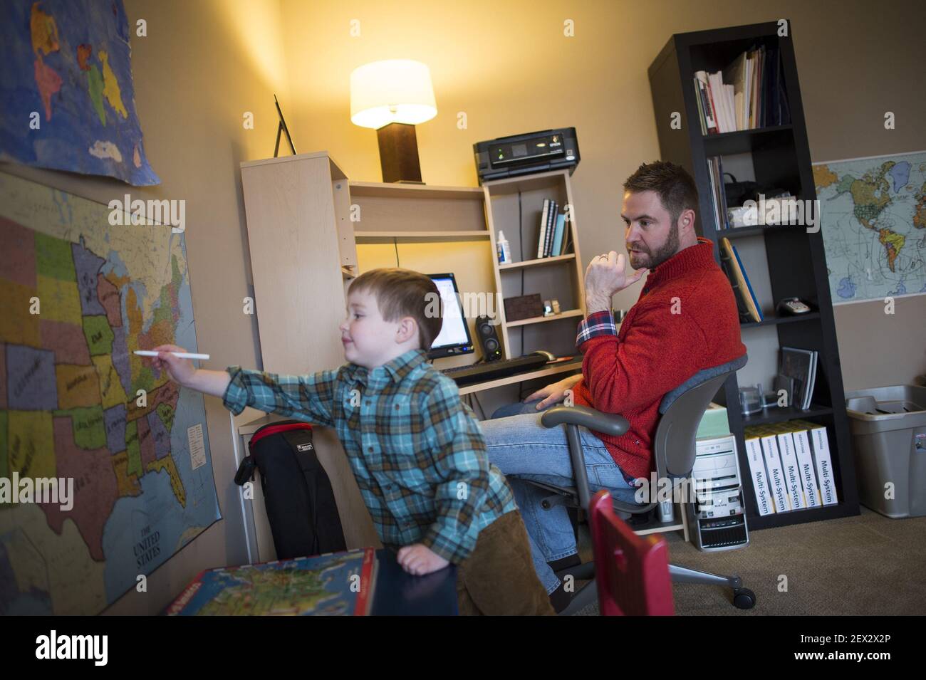 John Drevlow watches as his 3-year-old son, Eli, points to places he's ...