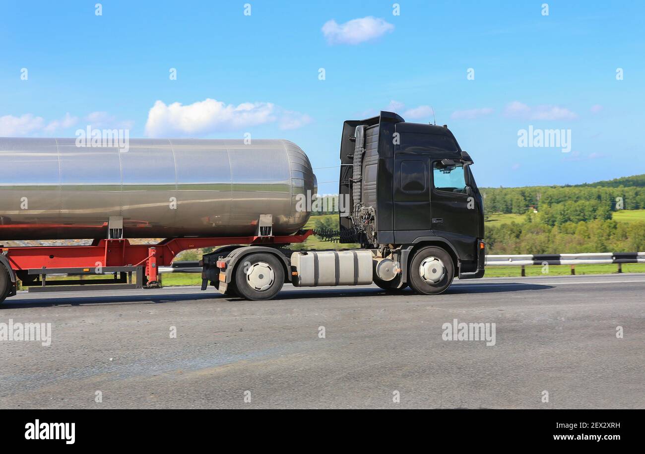 big fuel truck goes on the country highway Stock Photo - Alamy