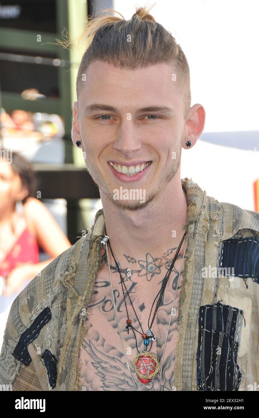 Machine Gun Kelly arrives at the 2015 MTV Movie Awards held at the ...