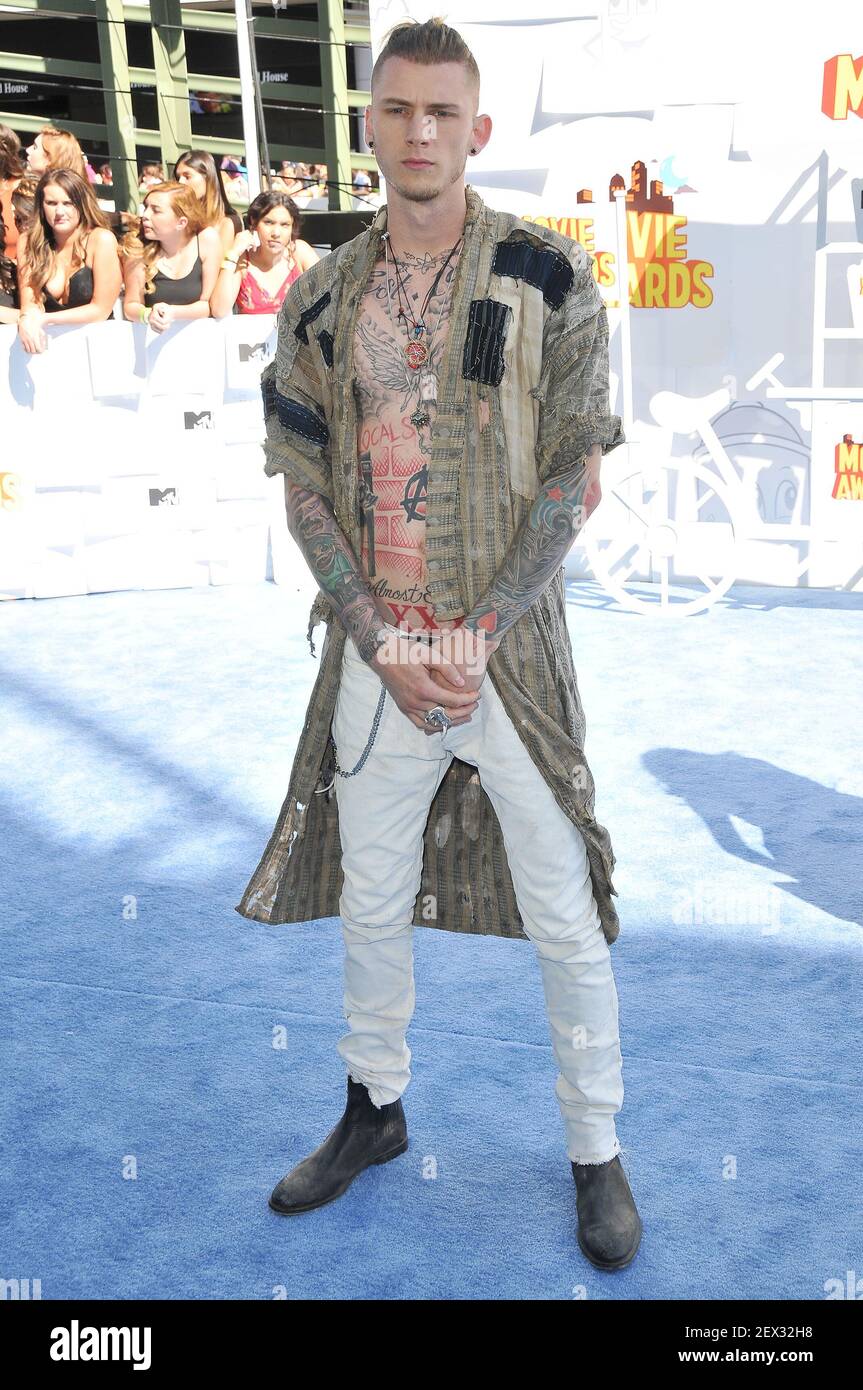 Machine Gun Kelly arrives at the 2015 MTV Movie Awards held at the ...