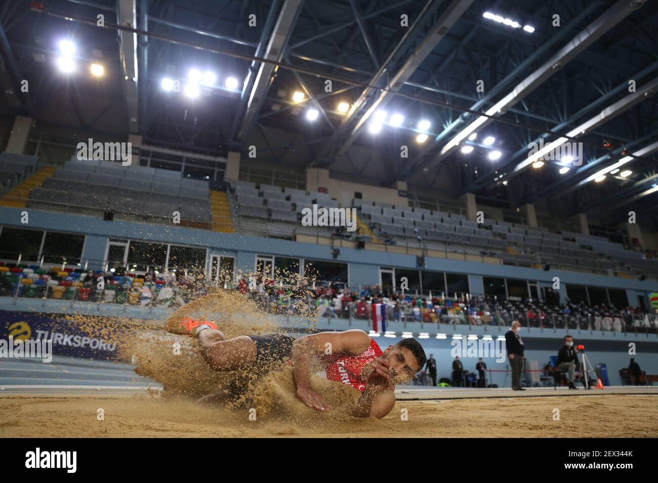 ISTANBUL, TURKEY - FEBRUARY 20, 2021: Undefined athlete long jumping ...